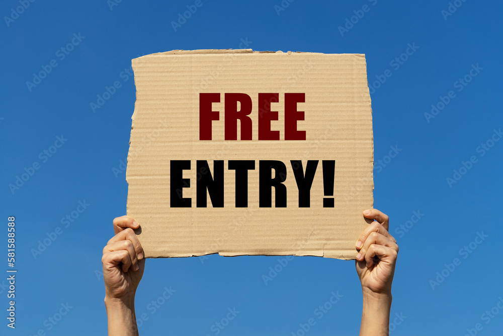Free entry text on box paper held by 2 hands with isolated blue sky ...