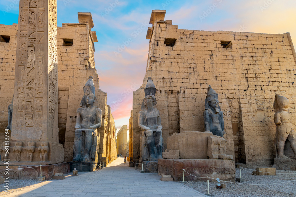 The entrance to the ancient Egyptian Luxor Temple with statues of ...
