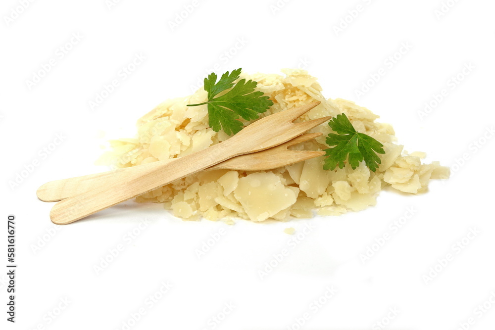 Parmesan cheese flakes isolated on white background. Pile of parmesan ...