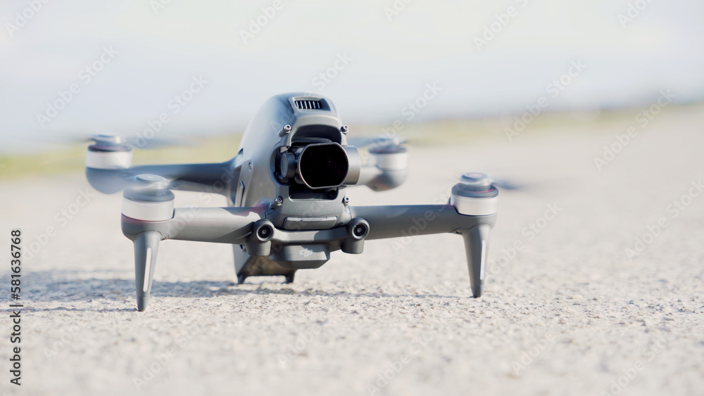 DJI FPV Drone on the floor with rotating propellers Stock Photo | Adobe ...