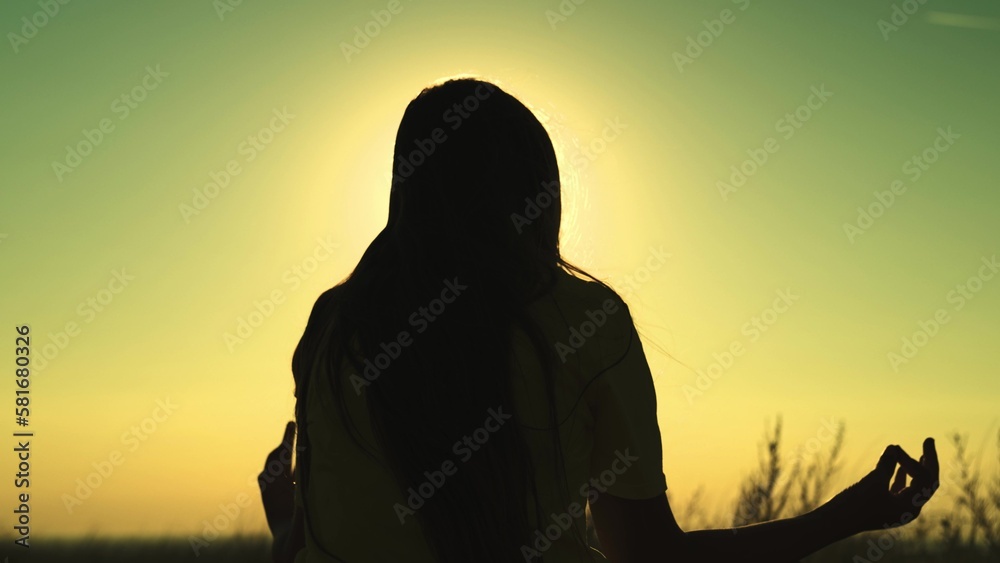 yoga hand sign. girl sunset doing yoga. female meditation glare sun ...