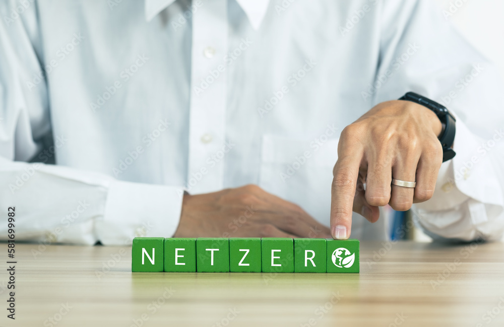 Businessman hand holding with green net center icon and green icon on ...