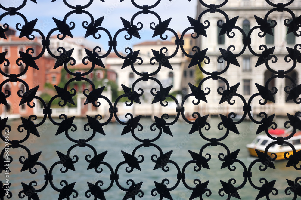 Detail of an ancient window with grating in wrought iron. Venice, Italy ...