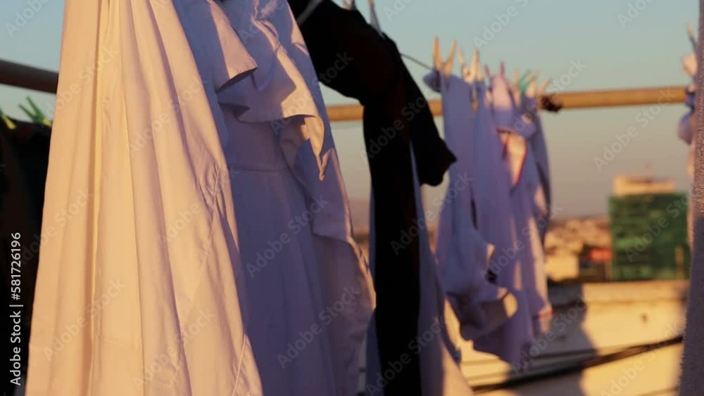 Hanging clothes drying in the air on a rooftop Stock Video | Adobe Stock