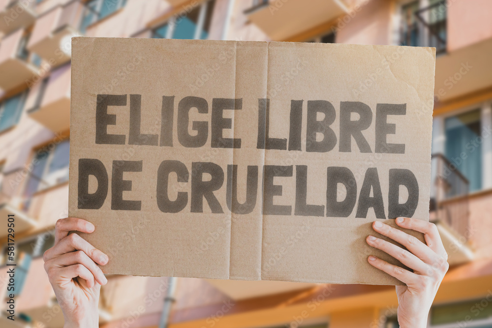 The phrase " Choose cruelty free " is on a banner in men's hands ...