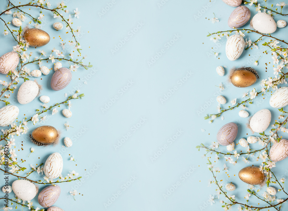 beautiful light easter layout with gold and marble eggs, cherry ...