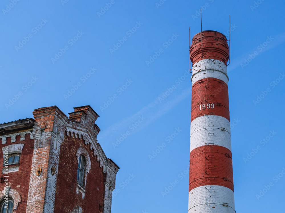 An old production pipe made of red brick, built in the 19th century ...