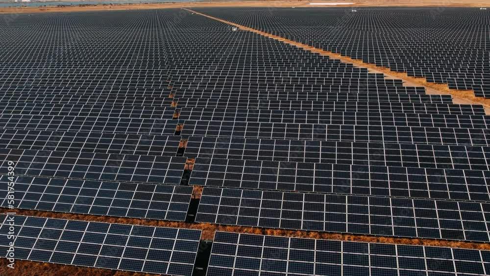 Solar farm, field or solar power plant in aerial with photovoltaic cell ...