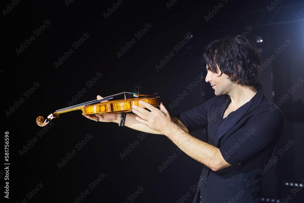 Violinist a player with a violin instrument in his hands. Artist of ...
