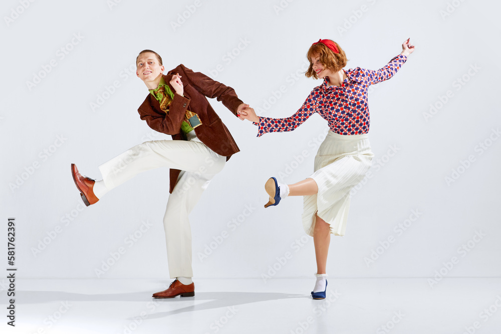 Synchronization of movements. Yung positive man and woman in stylish ...
