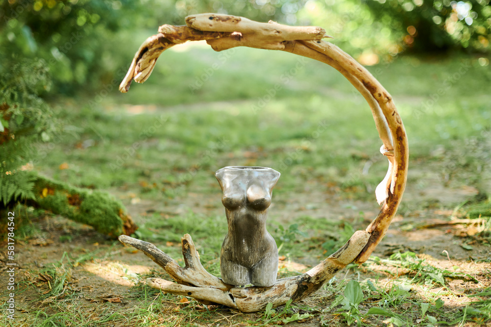 Female mannequin art object on outdoor green forest background, beauty ...