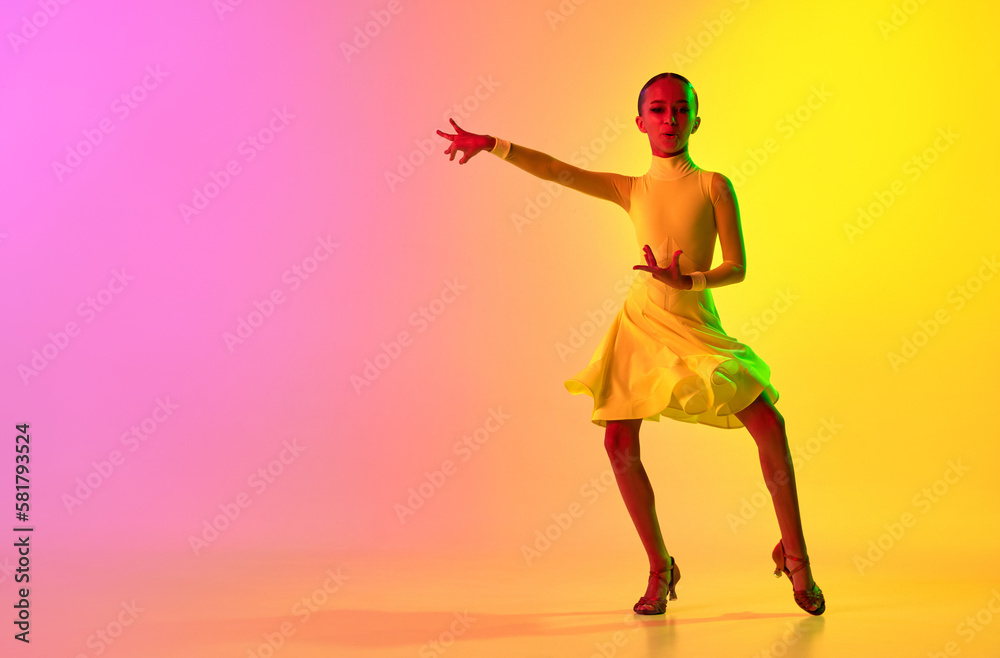 Expressive little girl in adorable stage outfit, dress dancing ballroom ...