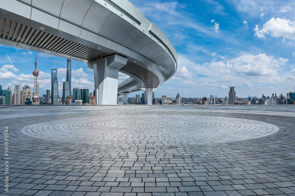 City square and pedestrian bridge with skyline in Shanghai, China ...