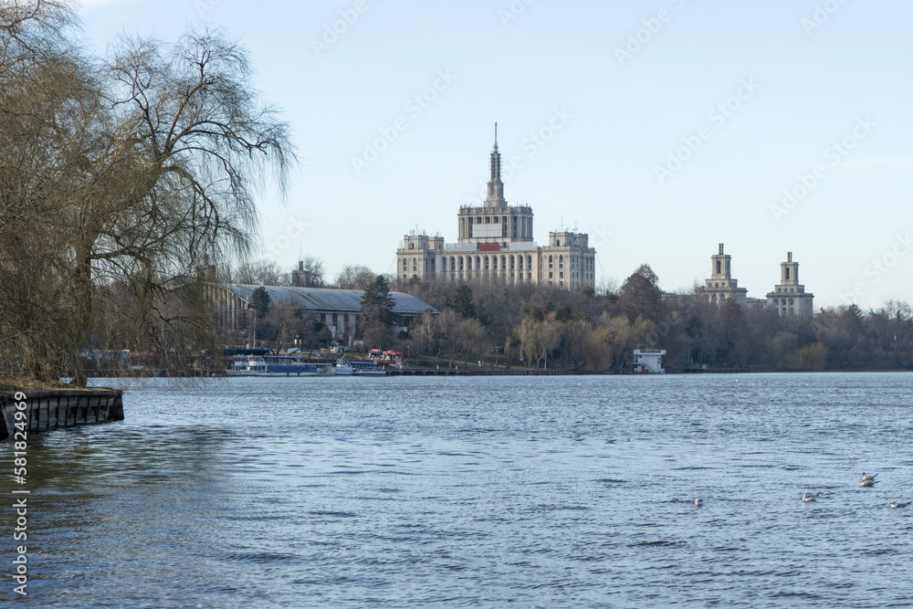 The cityscape stretches out before us, a maze of towering buildings and ...