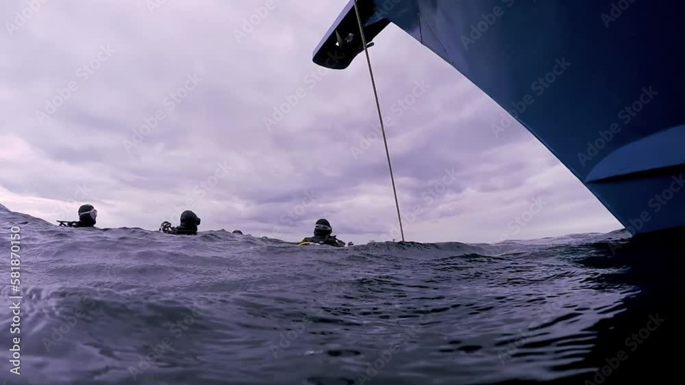 Large Group of Scuba Divers on Surface Preparing for Offshore Deep Dive ...