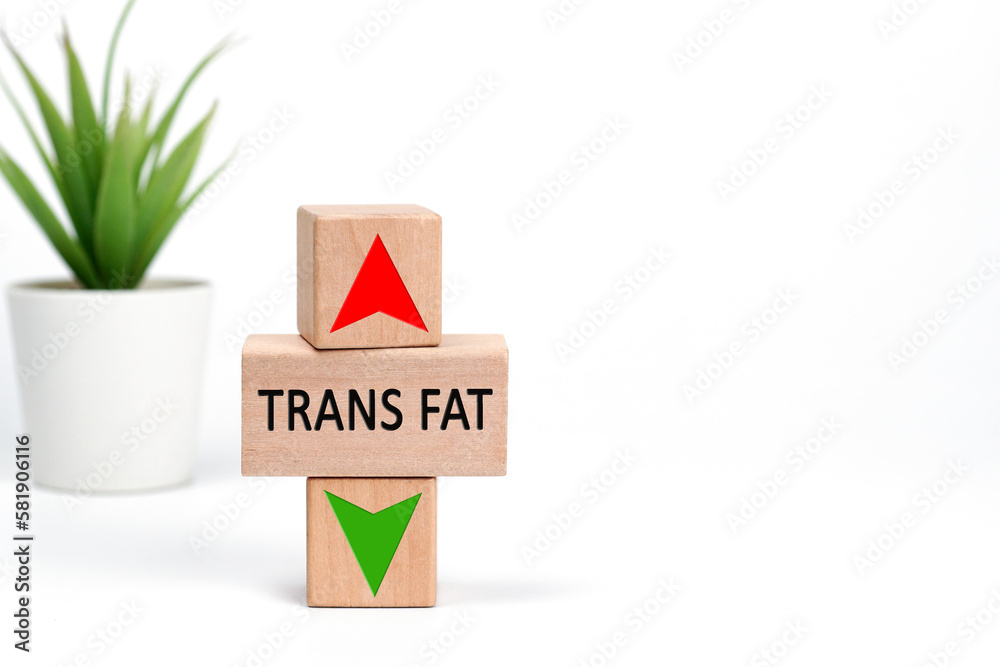 Trans Fats Free, Wooden cube block with TRANS FAT text, symbol arrow up ...