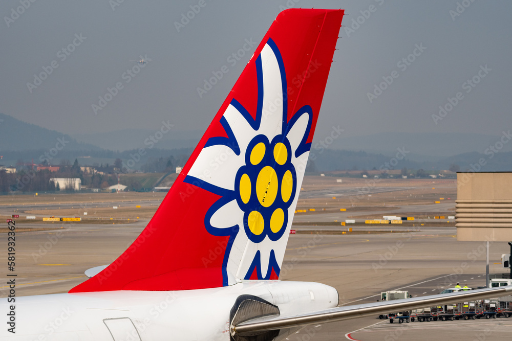 Rudder with Edelweiss Air logo on an Airbus A340-313 jet at the airport ...