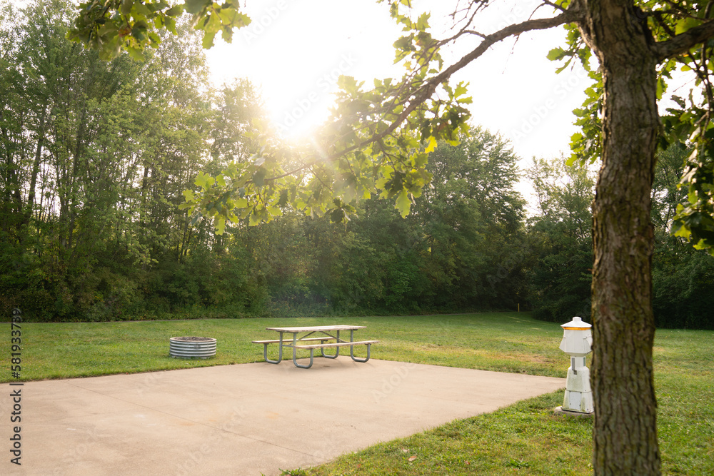 Empty Outdoor Campsite at a campground in Summer with a picnic table ...