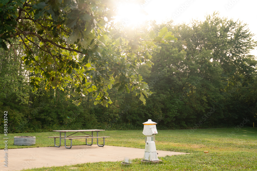 Empty Outdoor Campsite at a campground in Summer with a picnic table ...