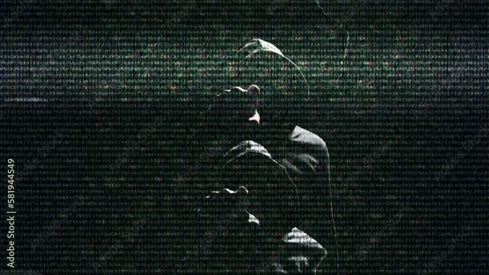 Isolated portrait of a mysterious figure in a black hoodie pointing a ...