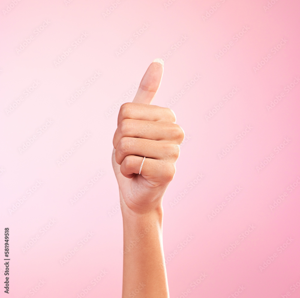 Thumbs up, yes and hand of woman in studio for success, approval ...