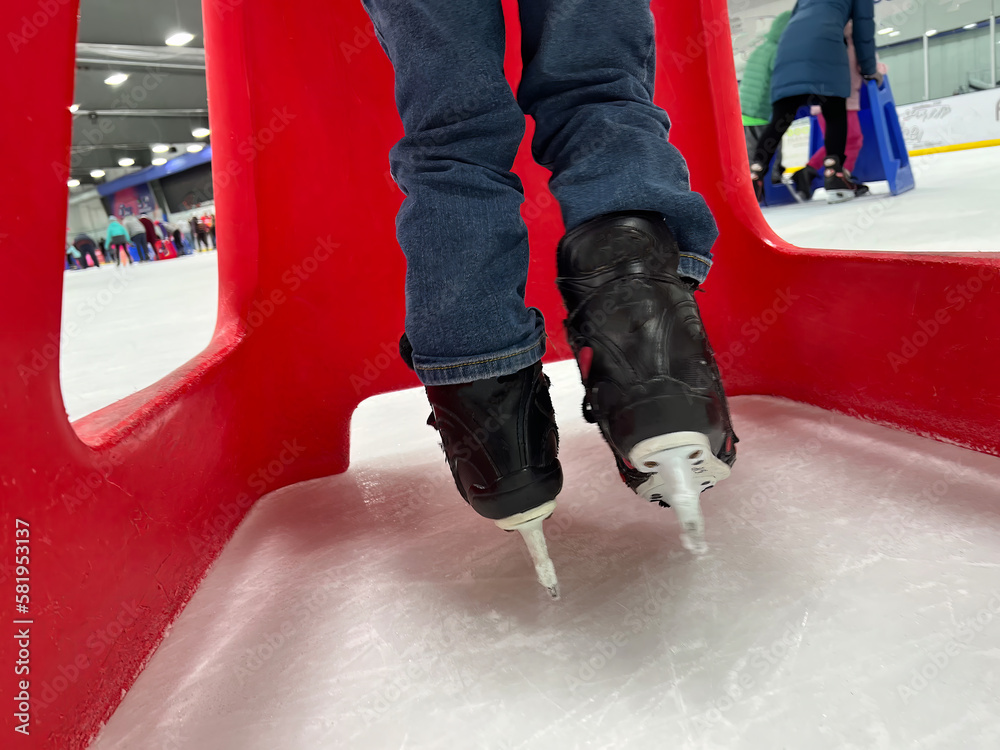 Beginner ice skater using a plastic walker for assistance. Stock Photo ...