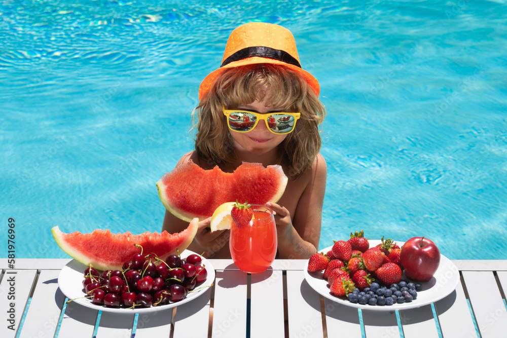 Child eat watermelon. Kid relaxing on sea beach or pool. Kid with ...