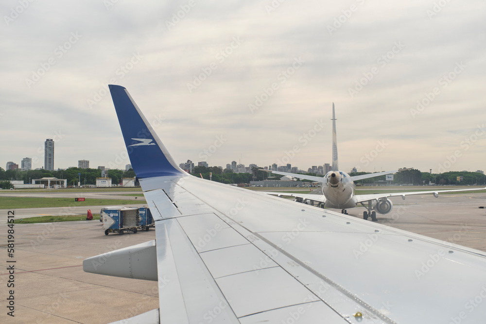 Airfield and airplane view from a window of a Boeing 737-700 jet of ...