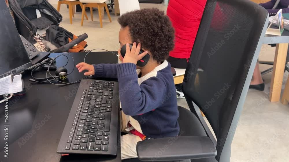 3-year-old black child learns by imitation, typing and making calls at ...