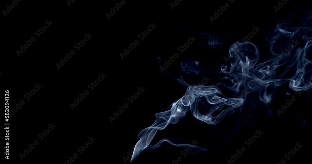 Real smoke on a black background. Thin Flexible Trickle of Real Smoke ...