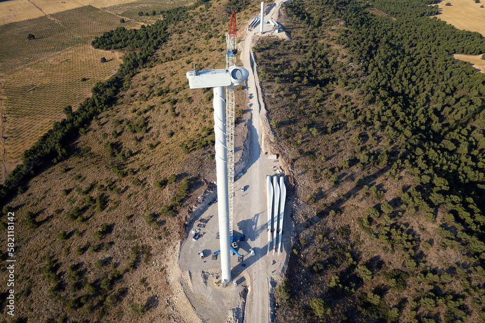 Top view of the Installation of a wind turbine farm. Team of ...