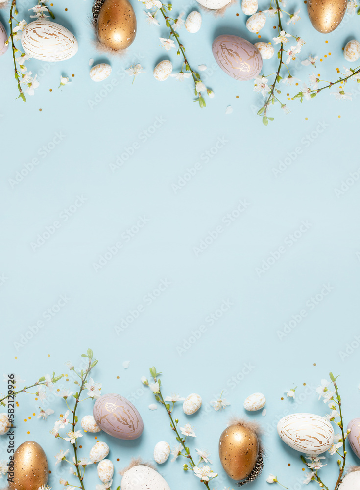beautiful light easter layout with gold and marble eggs, cherry ...