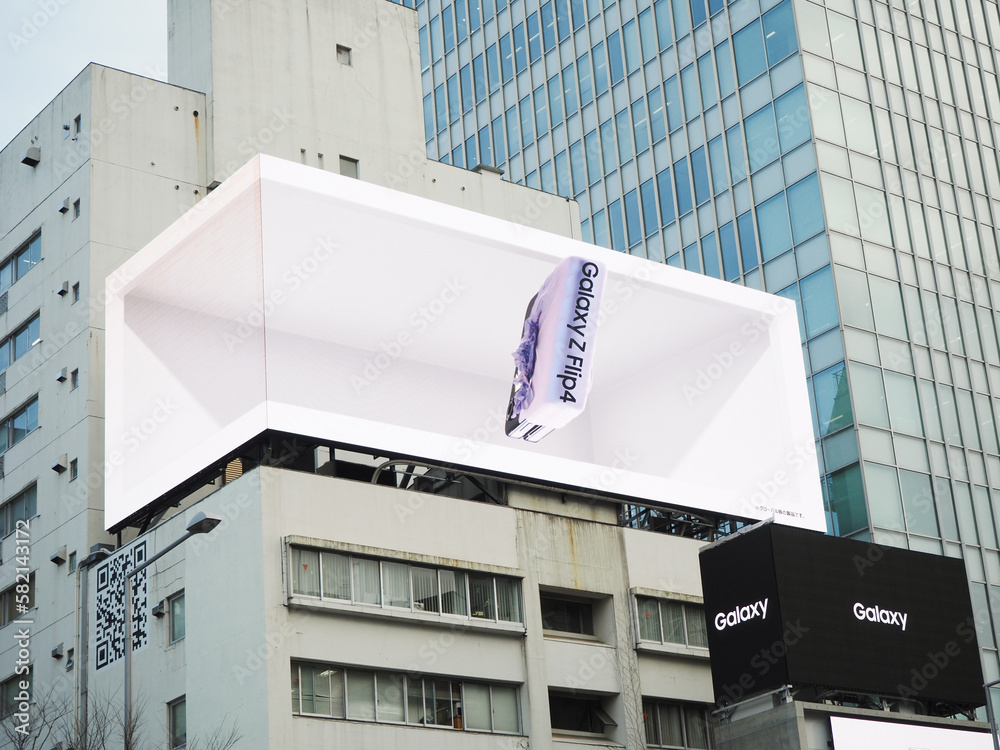 TOKYO, JAPAN - March 1, 2023: A 3D billboard featuring an advert for ...