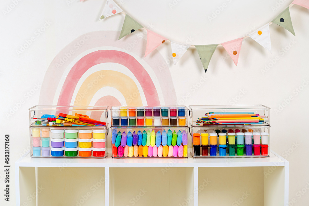 Transparent plastic containers with stationery and supplies for drawing ...