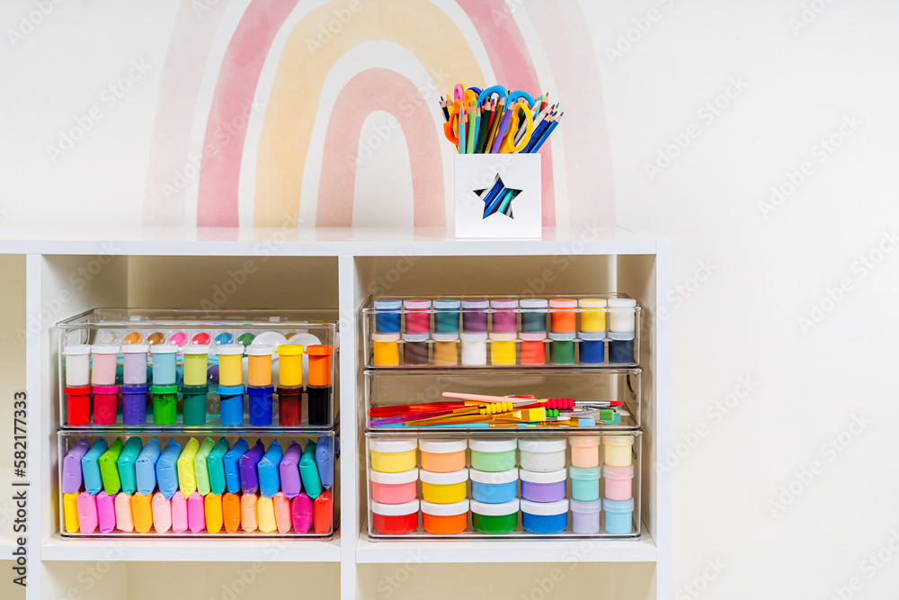 Transparent plastic containers with stationery and supplies for drawing ...