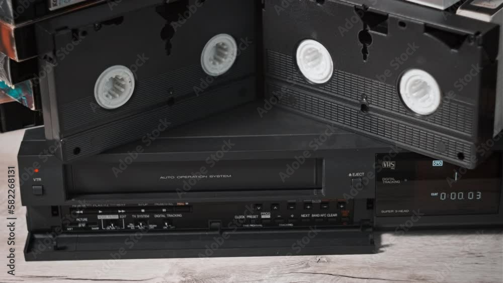 Eject Vhs Tape Cassette From Vcr Player Male Hand Pulls Out Vhs From A Vintage Videotape