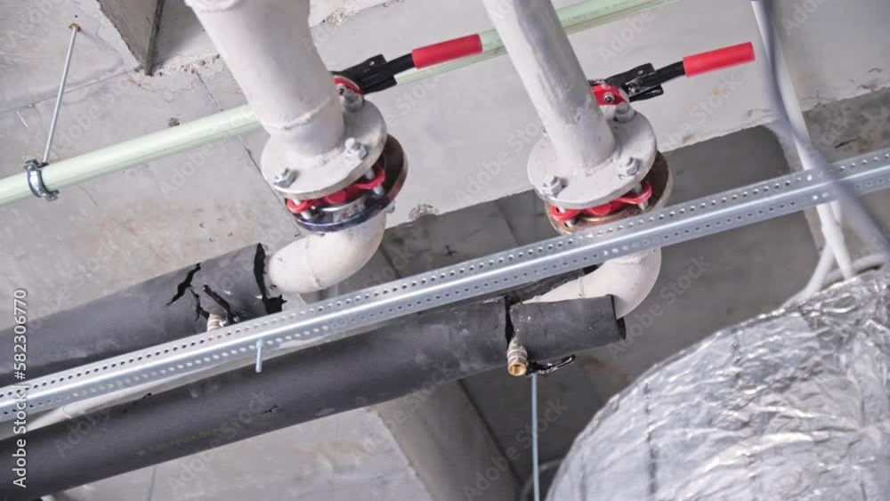 Metal pipes with flanges and levers of fire suppression system under ...