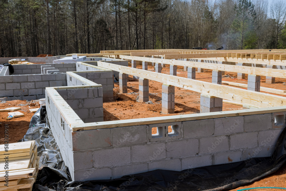 Cement blocks laid wall for foundation of house on construction site ...