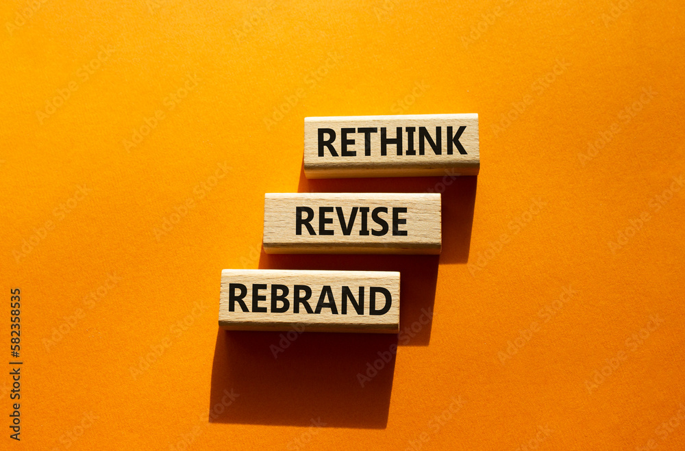 Rethink Revise Rebrand symbol. Wooden blocks with words Rethink Revise Rebrand. Beautiful orange ...