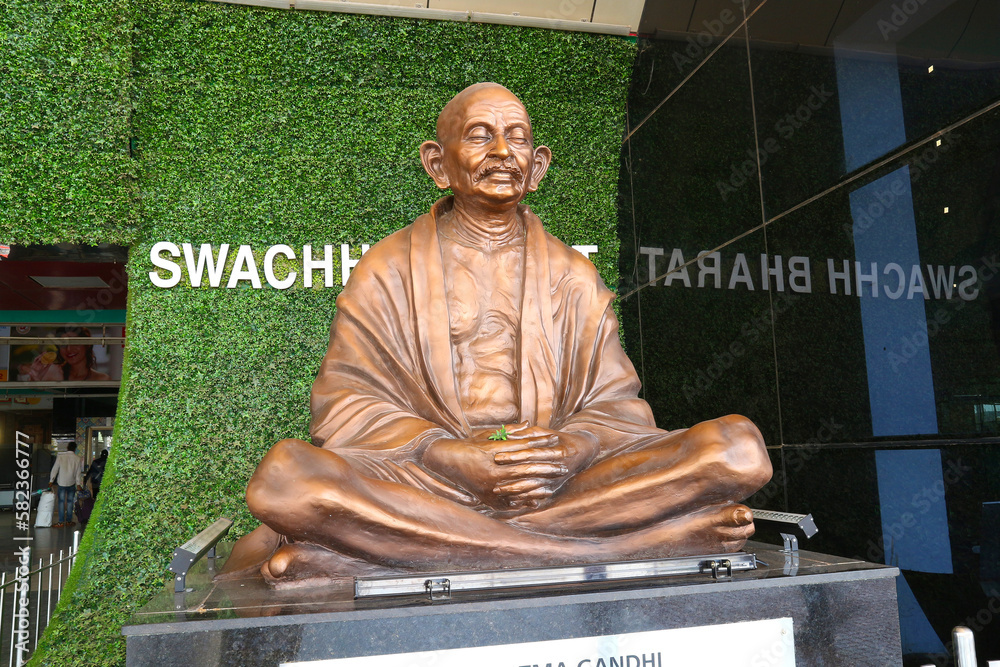Mahatma Gandhi sits in a meditative pose. Sculpture of Mohandas Gandhi ...