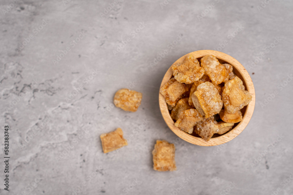 Pork rind. Crispy pork rinds are made from fine pork skin in a wooden ...