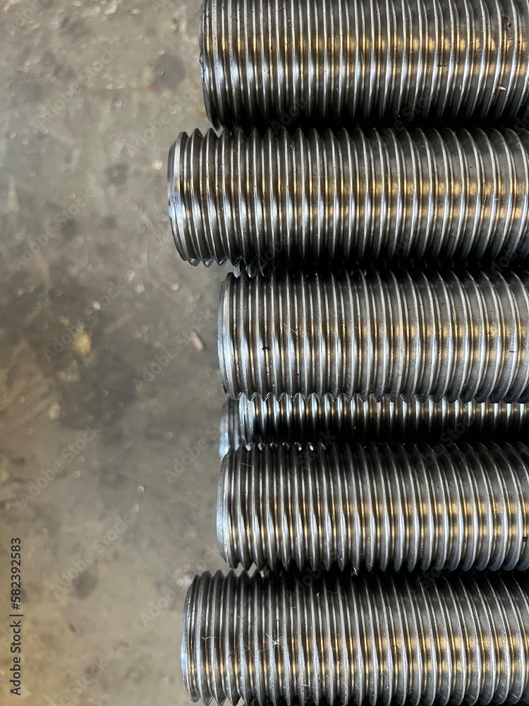 Top view and close-up photo of bolt threads arranged on many floor ...
