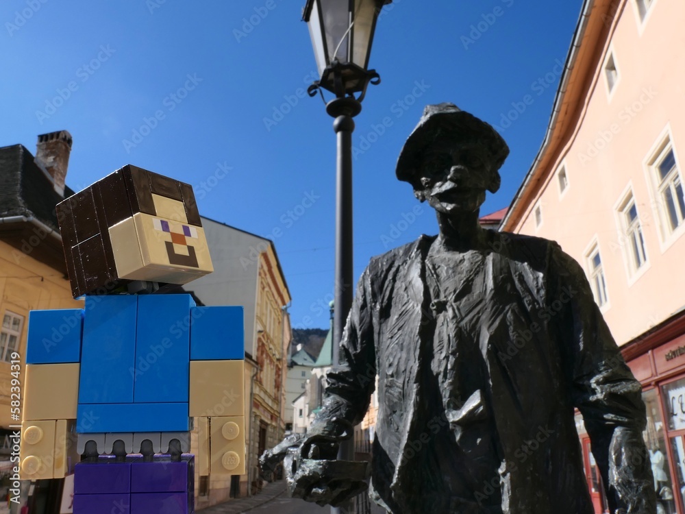 LEGO Minecraft figure of Steve standing next to sculpture of miner ...
