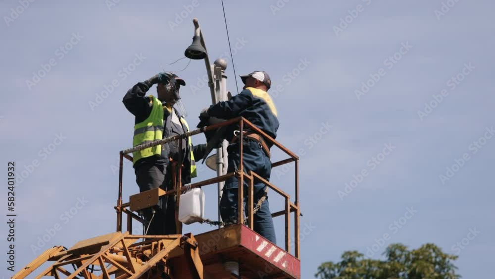 Electric technical, repair street lamp, equipment installs. Worker ...