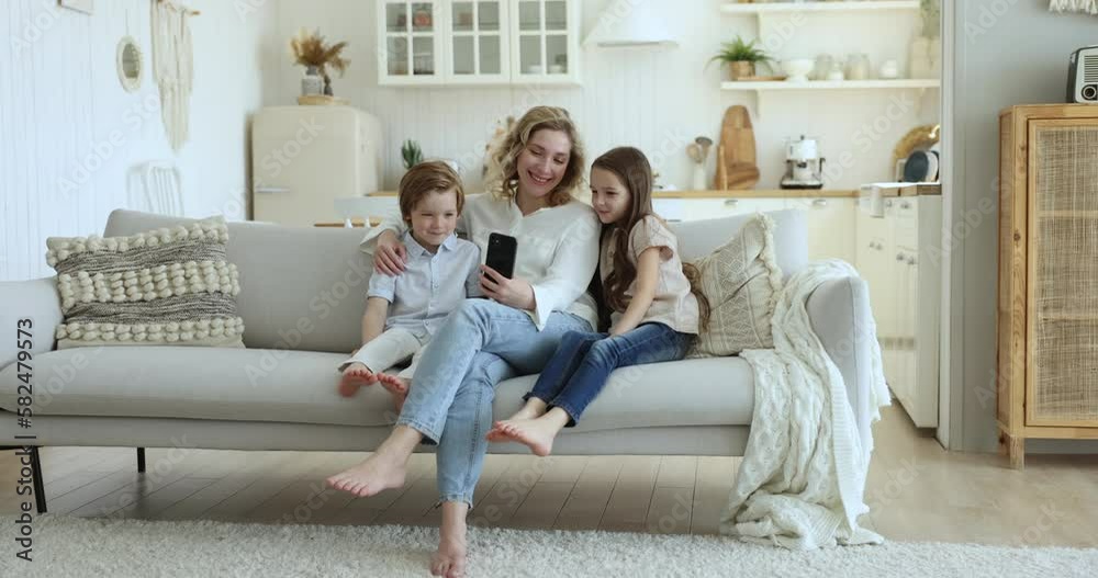 Vídeo do Stock: Happy family blogger mom and two kids taking self video ...