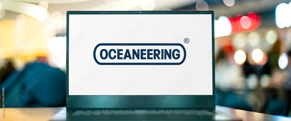 Laptop computer displaying logo of Oceaneering International Stock ...