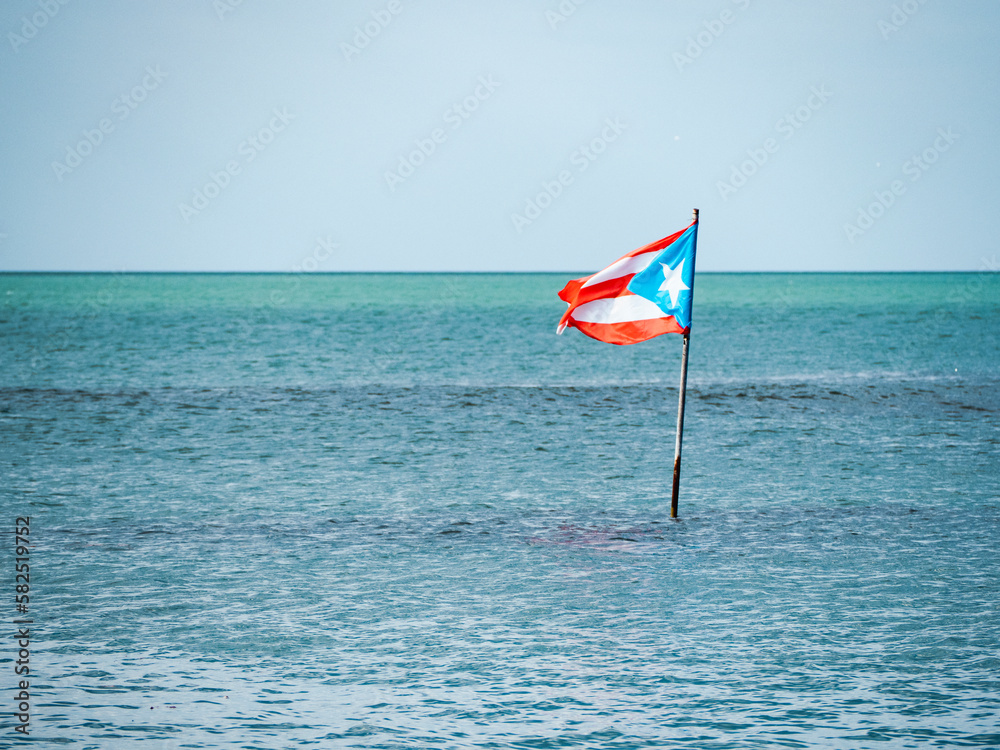 Puerto Rican flag in the middle of the ocean Stock Photo | Adobe Stock