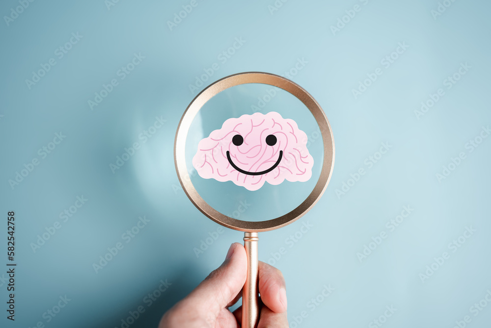 Magnifier focus to human brain and smile mental health sign positive ...