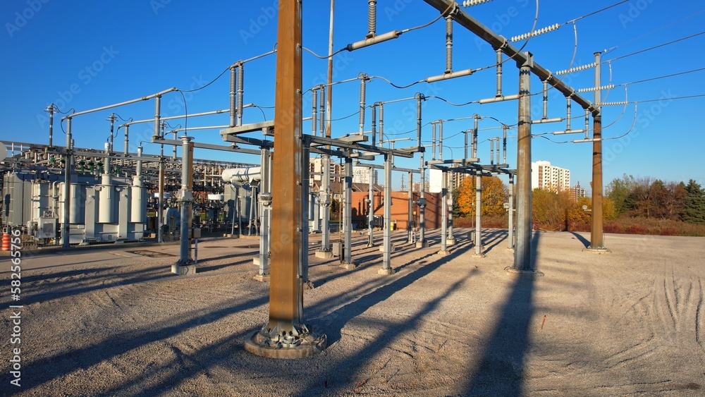 High voltage power grid station. Pylons and high voltage transferring ...