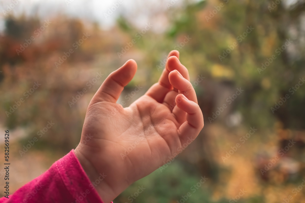 open child hand representing many emotions like sad, love and many more ...